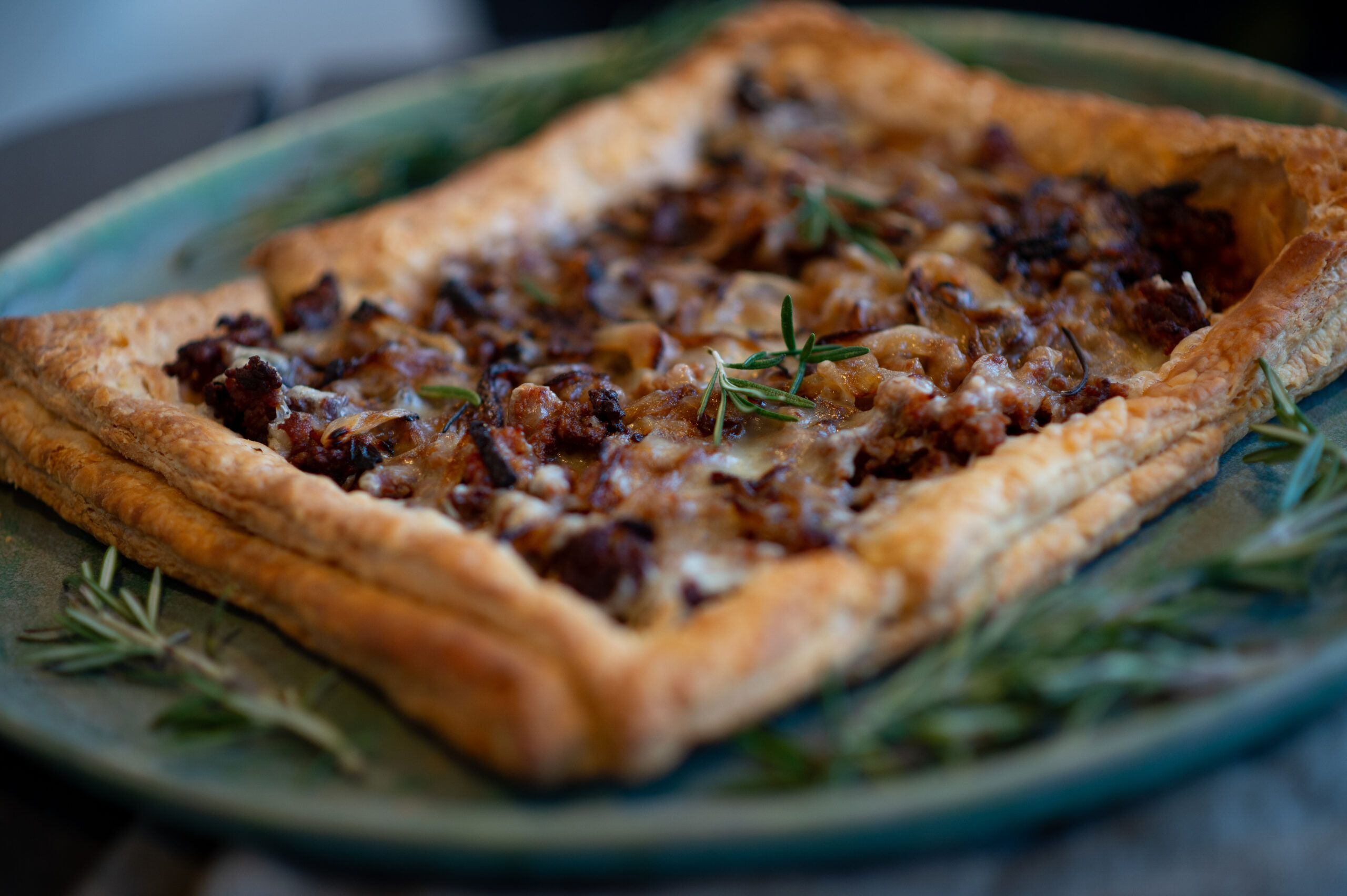Italian crumbled sausage, caramelized onions, fontina, & rosemary puff ...